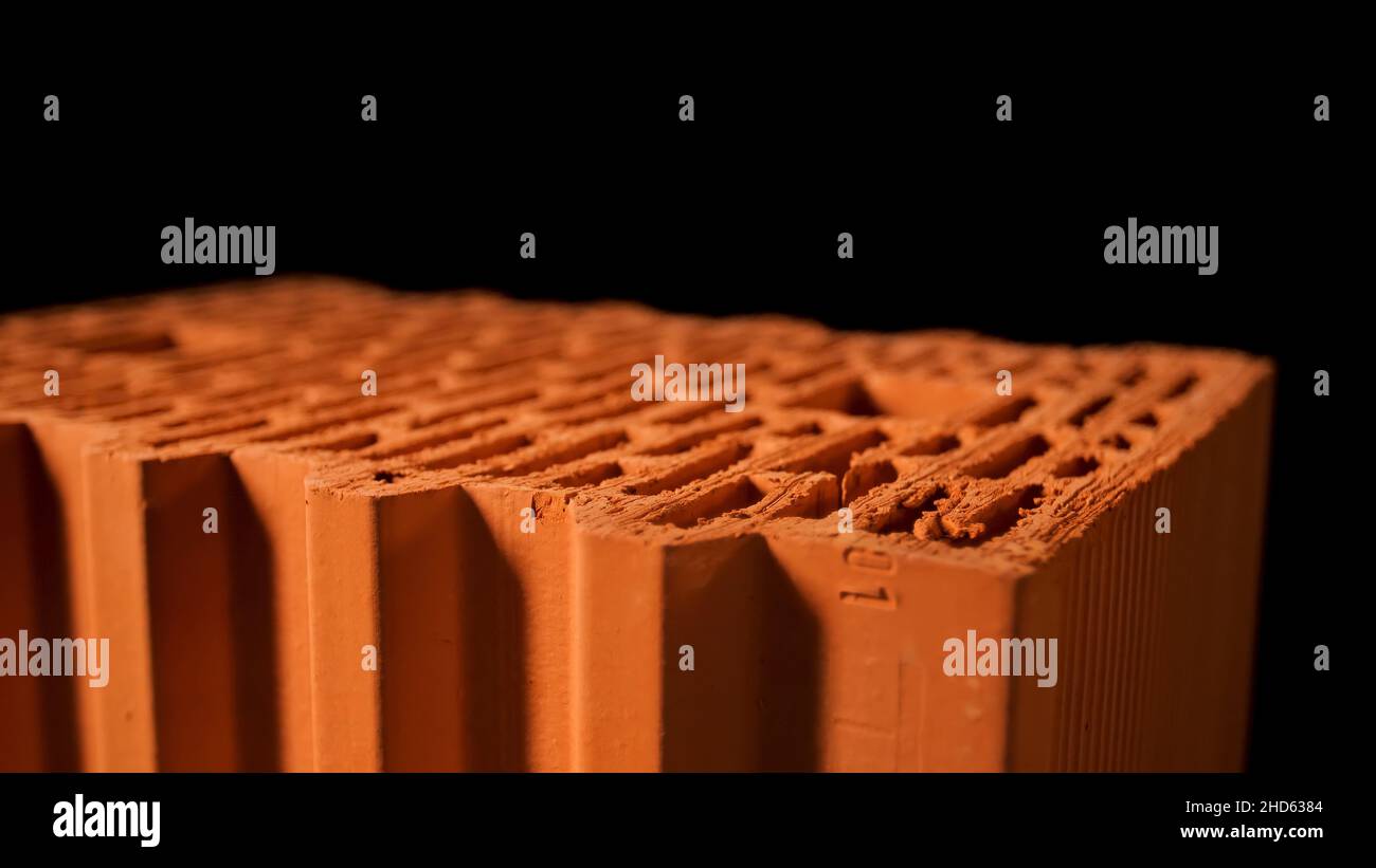 Close up of perforated ceramic blocks with round holes isolated on ...