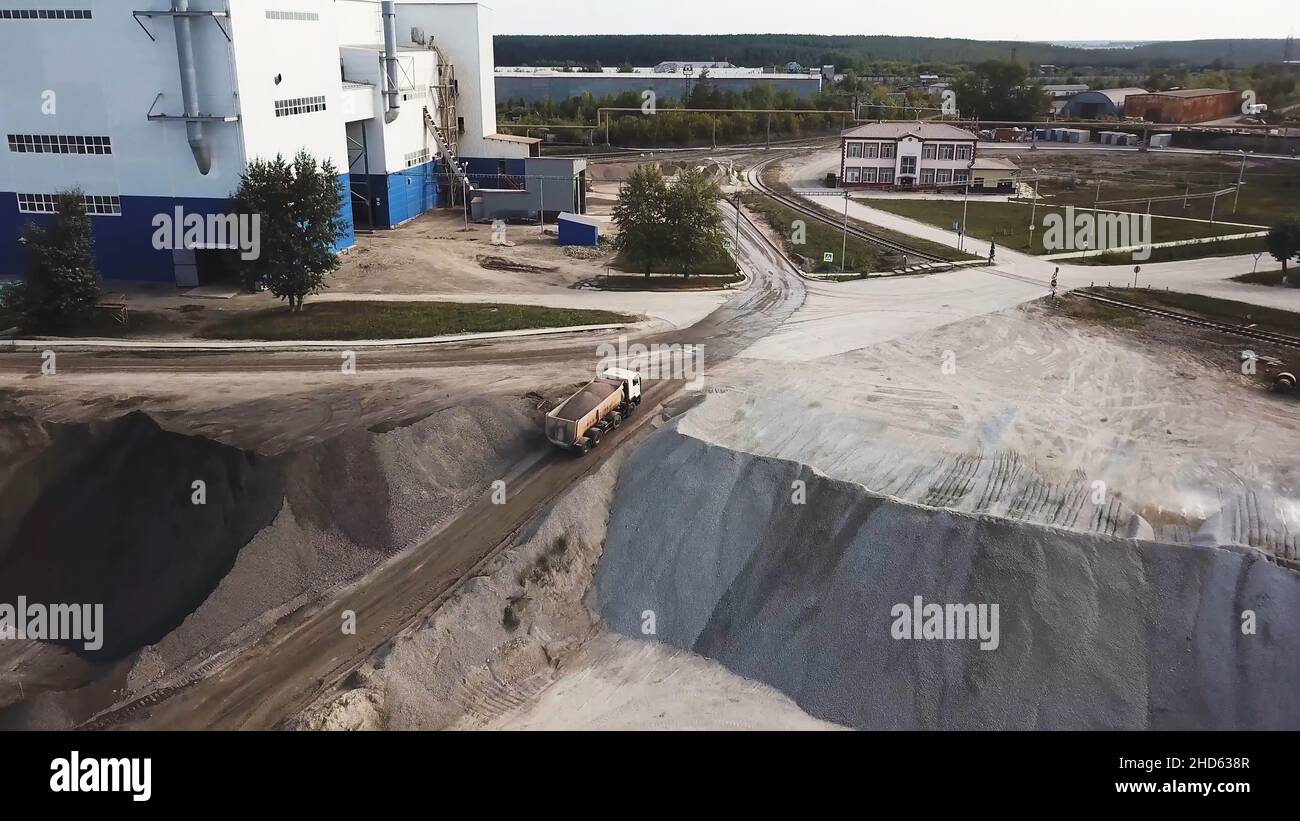 Aerial top view of quarry during work hours. Industrial background with ...