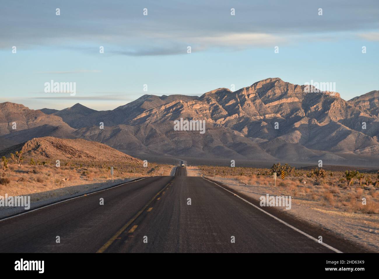 A spectacular open road and winter sunset mountain view from Highway ...