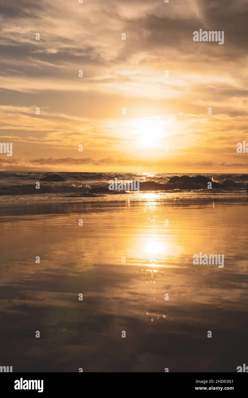 Low angle shot of dramatic beach sunset over the Pacific Ocean,travel ...