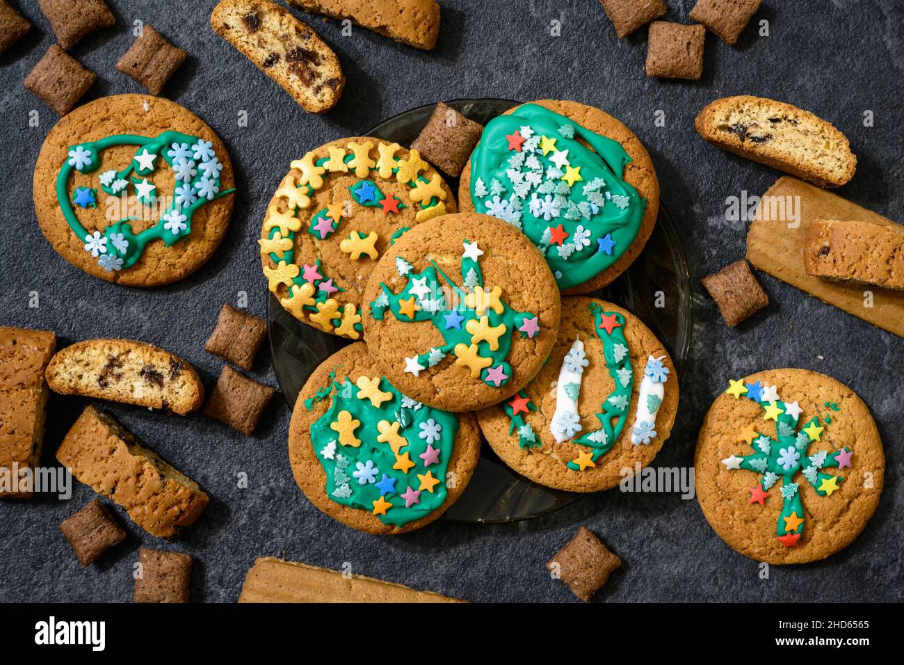 Tasty homemade cookies, flat lay. Stack of different biscuit decorated ...