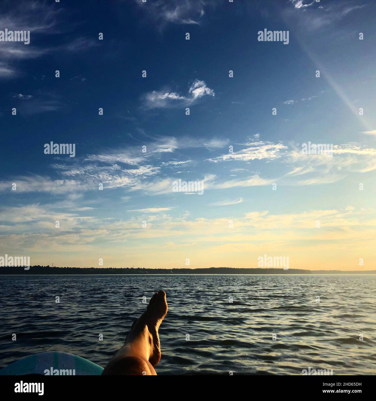 Lying on paddle board hi-res stock photography and images - Alamy