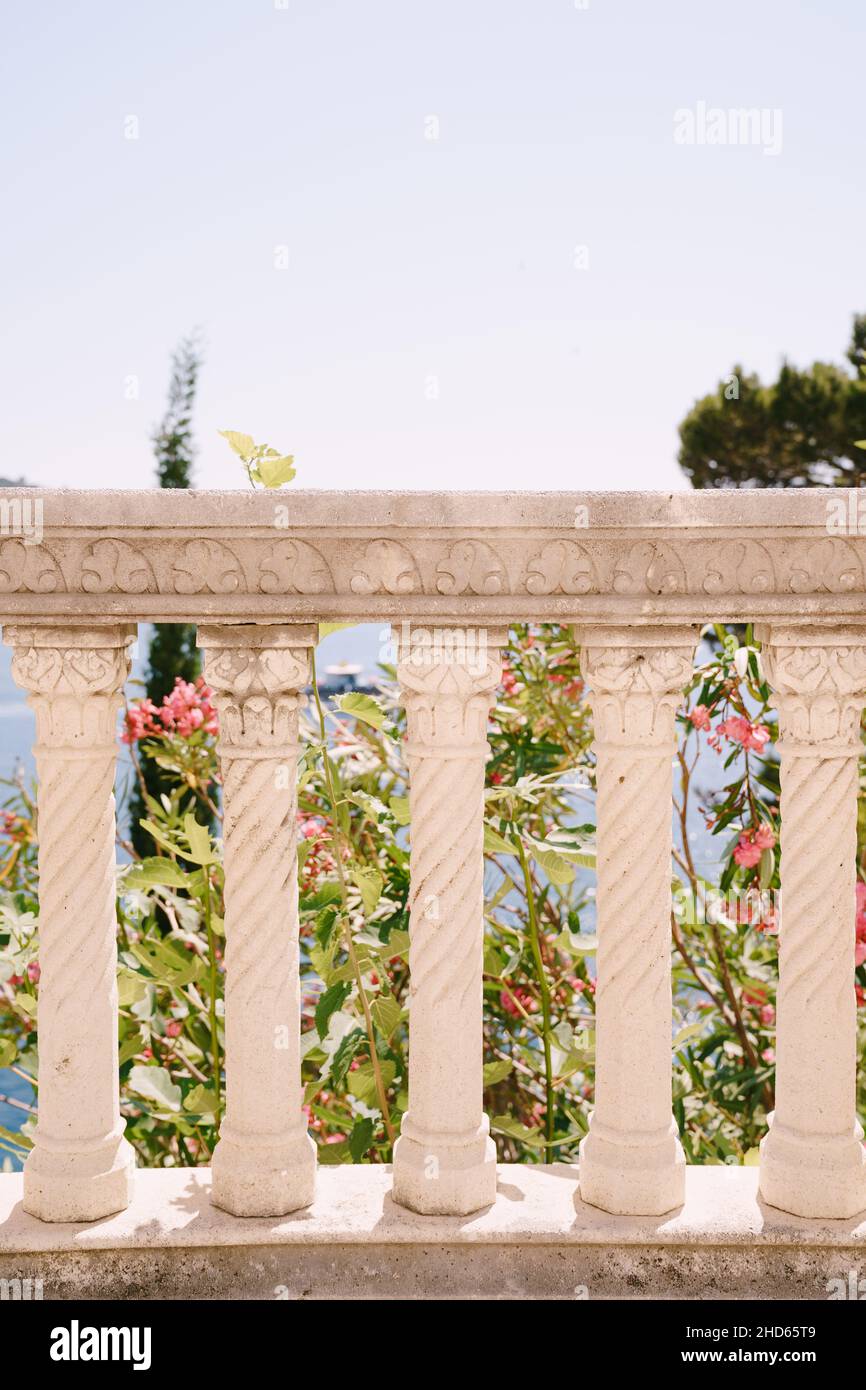 Carved stone balustrade with patterns against the background of ...