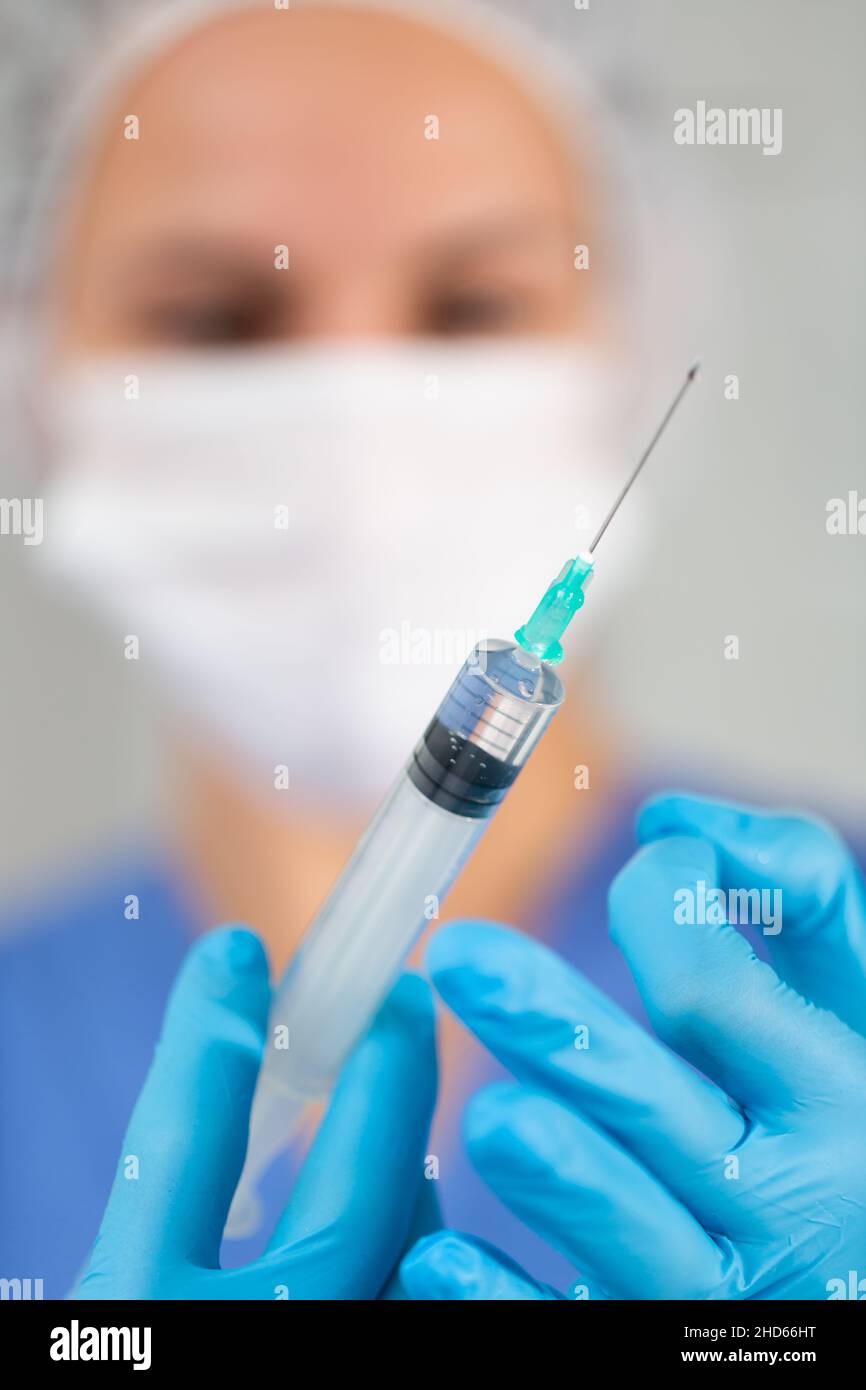 Nurse fills syringe injection hi-res stock photography and images - Alamy