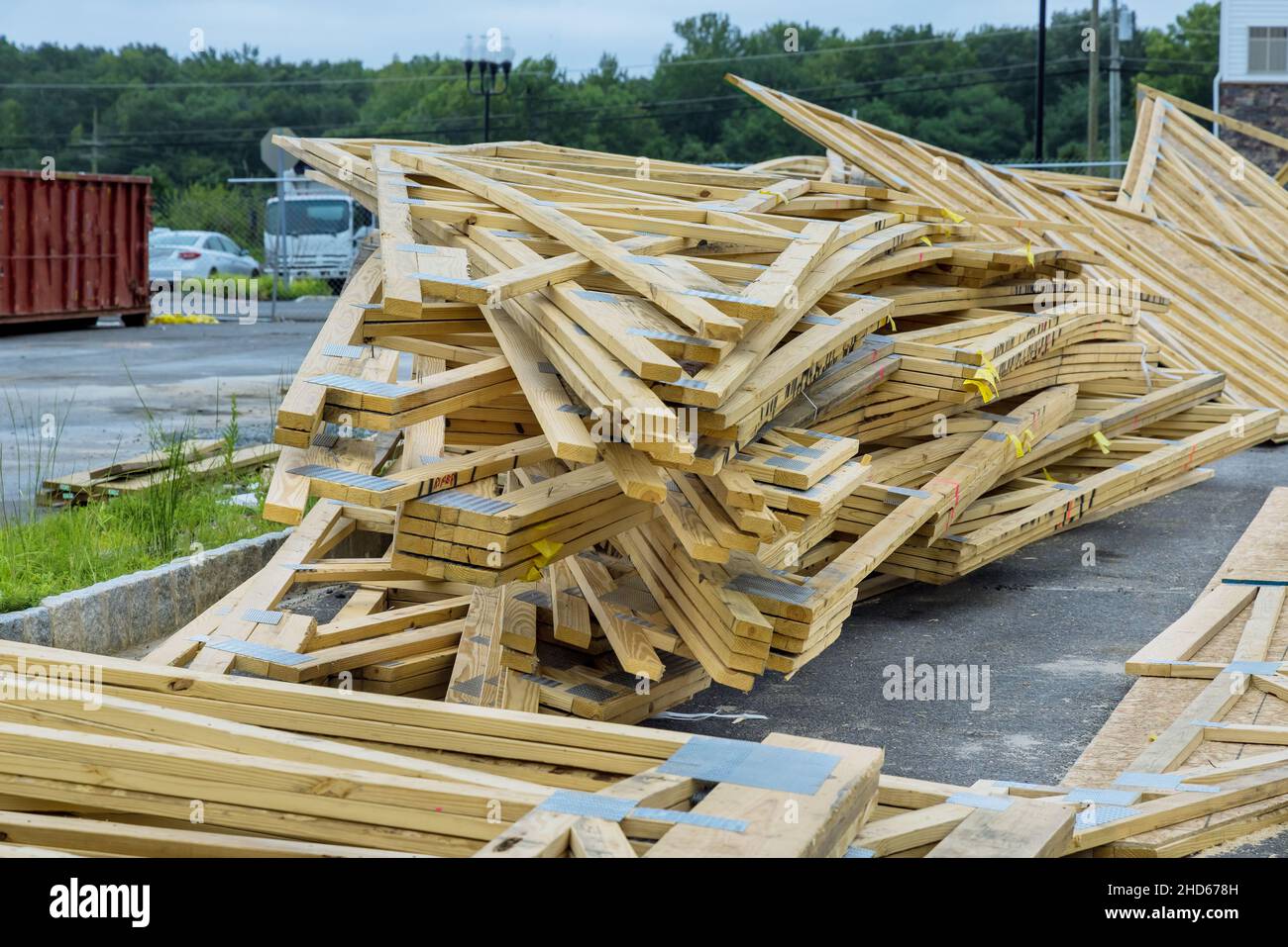 Material for the construction of a wooden building with stack of wooden ...
