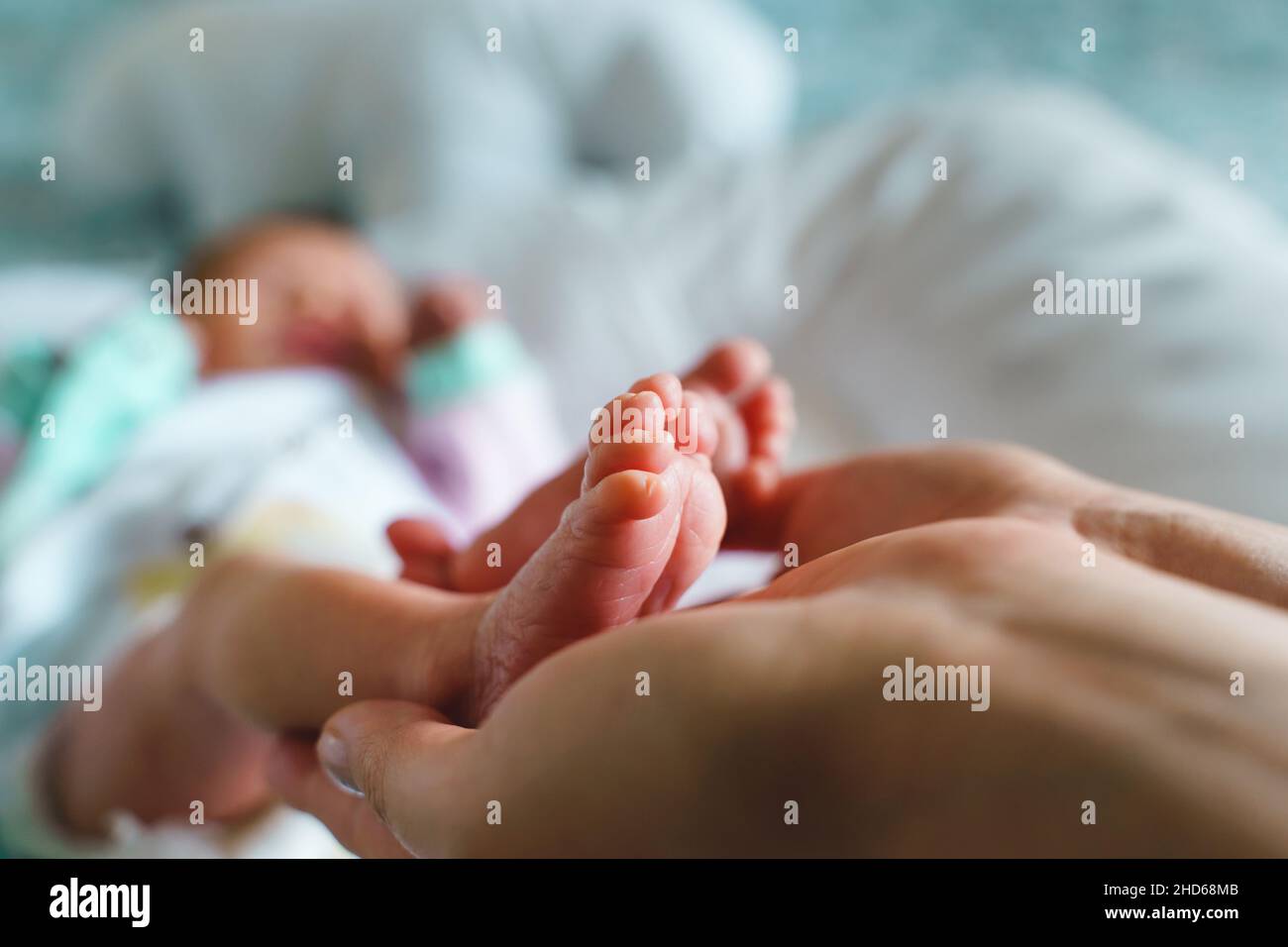 Baby touching foot hi-res stock photography and images - Alamy