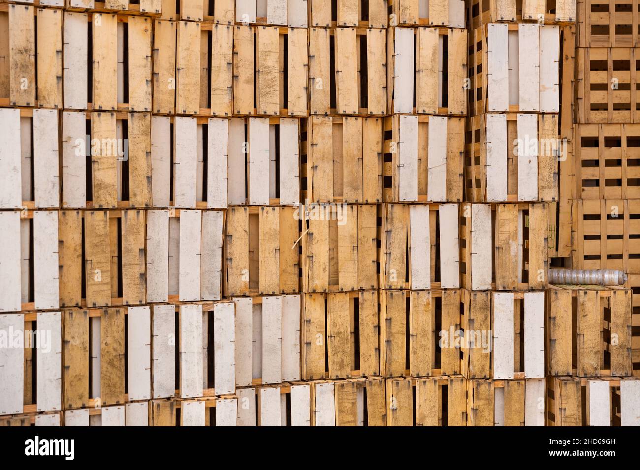 Old and used wooden boxes stacked Stock Photo - Alamy