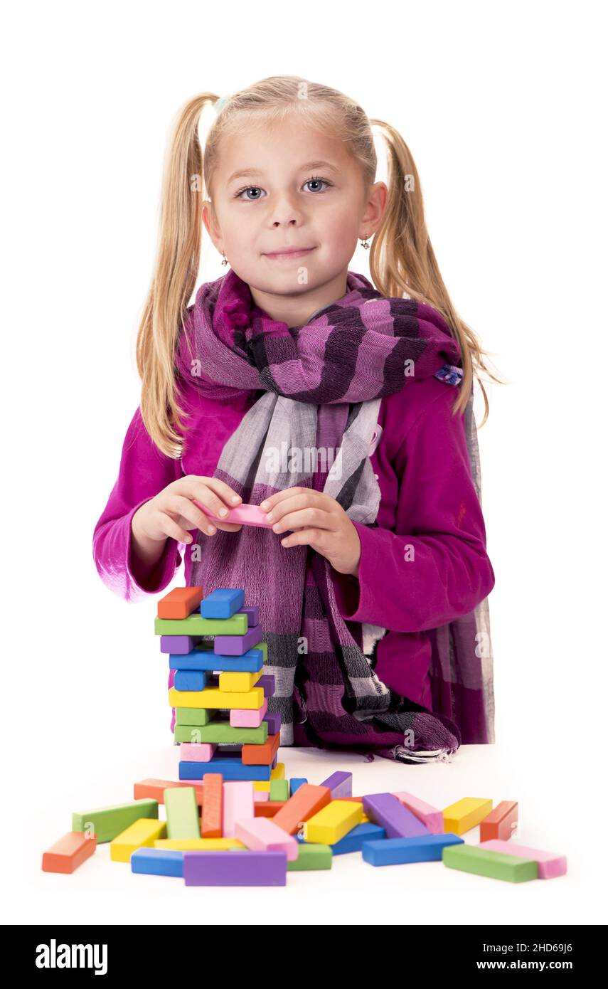 Children's hobbies, creativity, a little girl in a blue dress playing ...