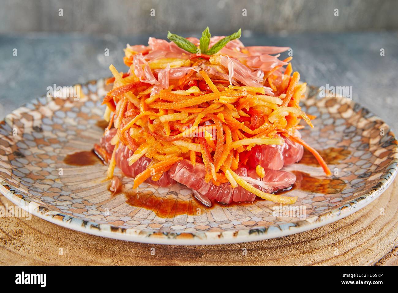 Carrot, apple, nut and pamela salad on plate. French gourmet food Stock ...