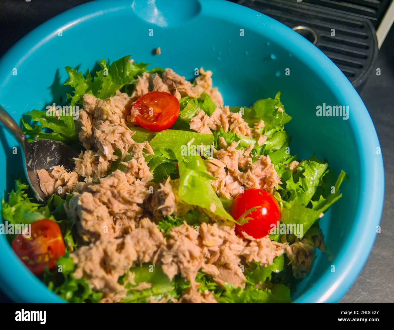 a spoon in tuna salad without dressing on a kitchen table Stock Photo ...