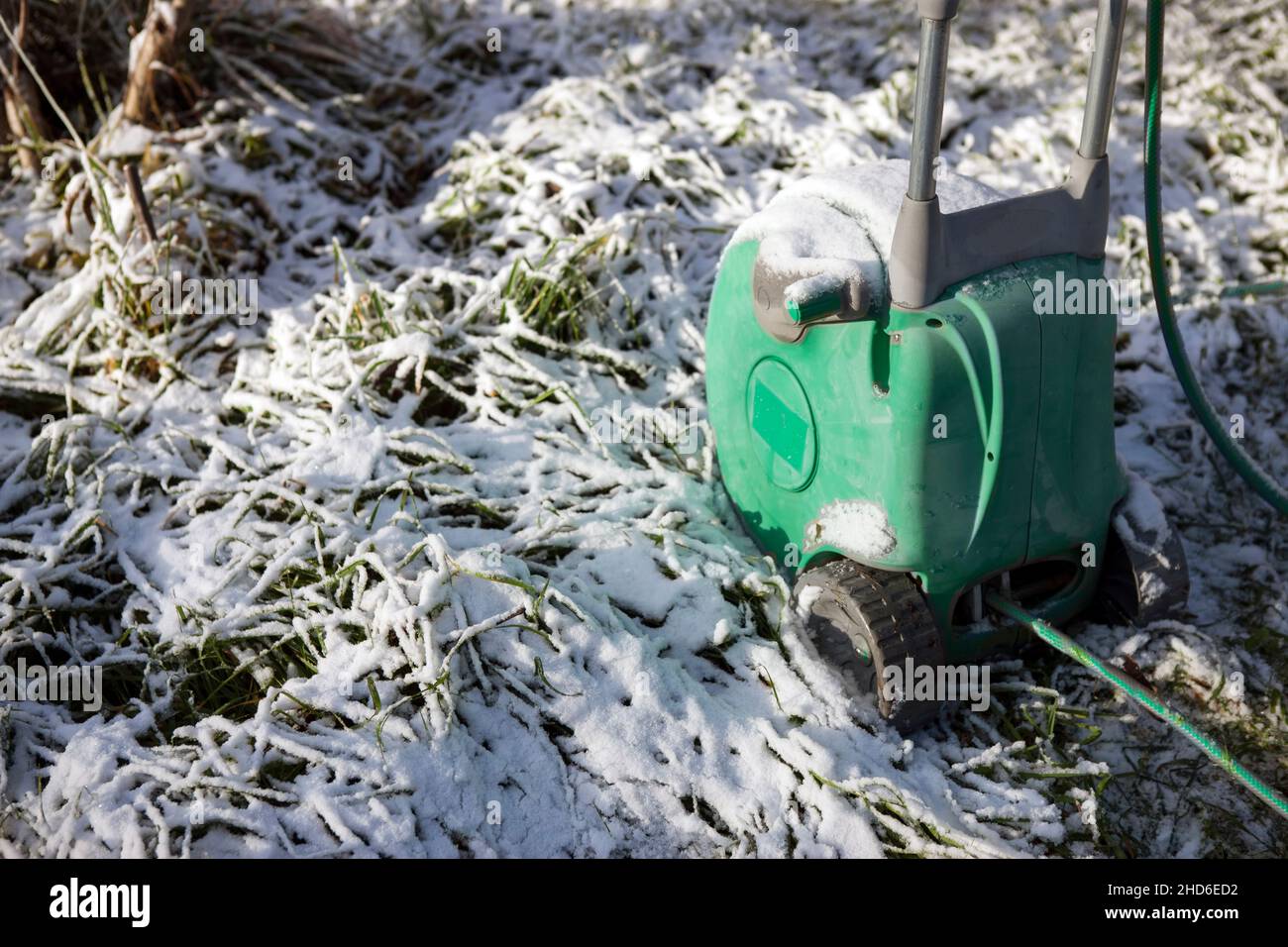 a frozen portable watering cart abandoned outdoor, winter scene Stock ...