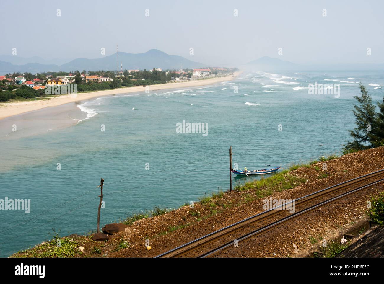 Scenic view of Lap An lagoon and Lang Co beach with railroad running ...