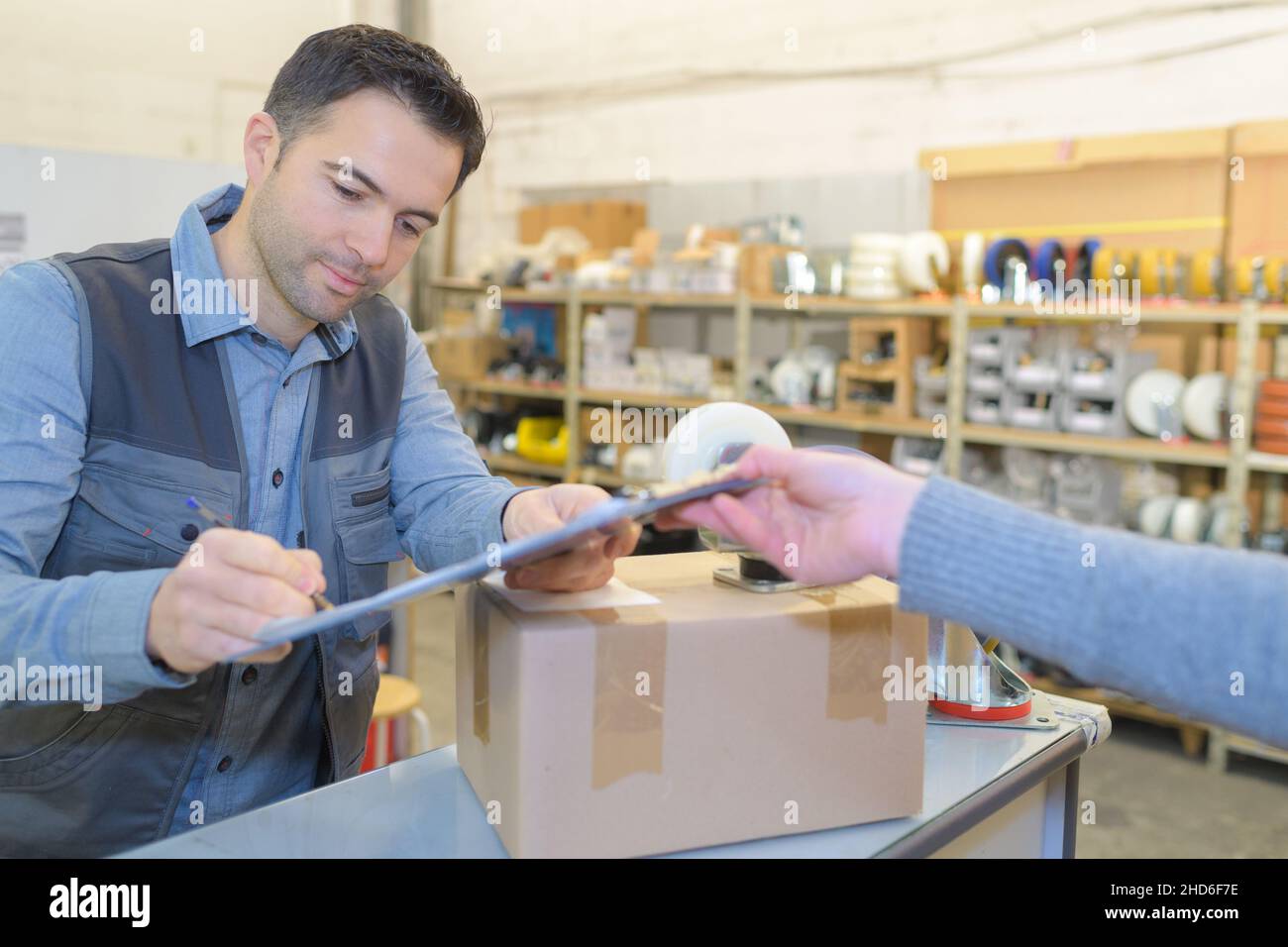 dispatcher of warehouse signing document before receiving goods Stock ...