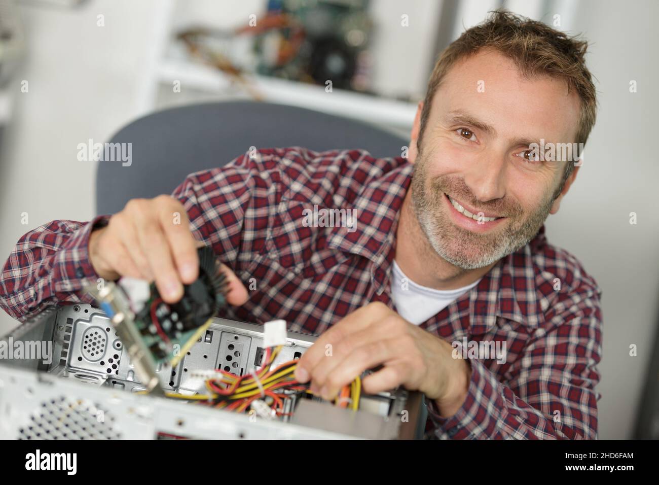 happy man fixing a pc Stock Photo - Alamy