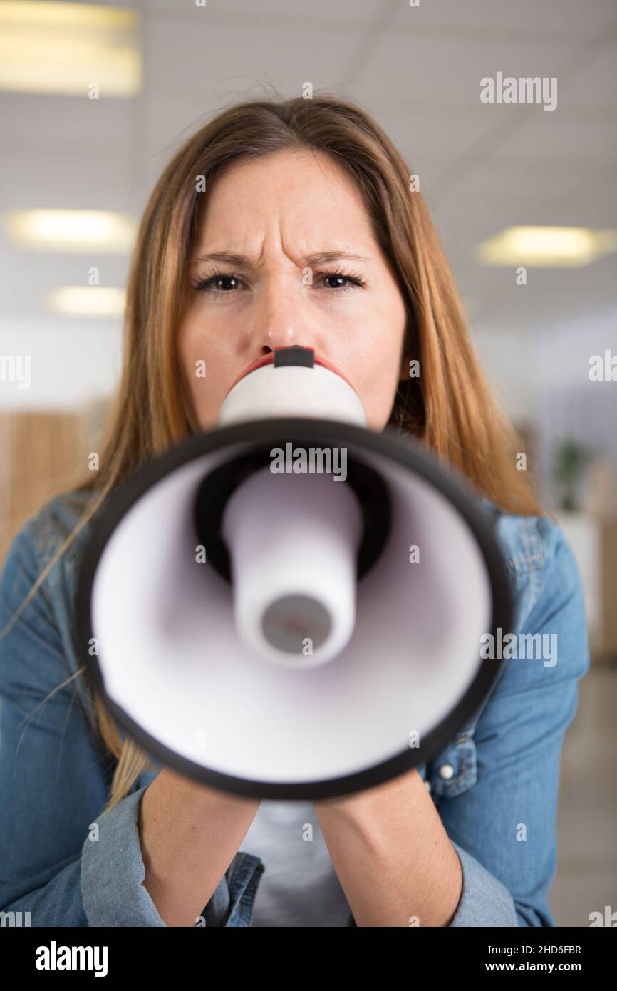 woman behind a loud speaker Stock Photo - Alamy