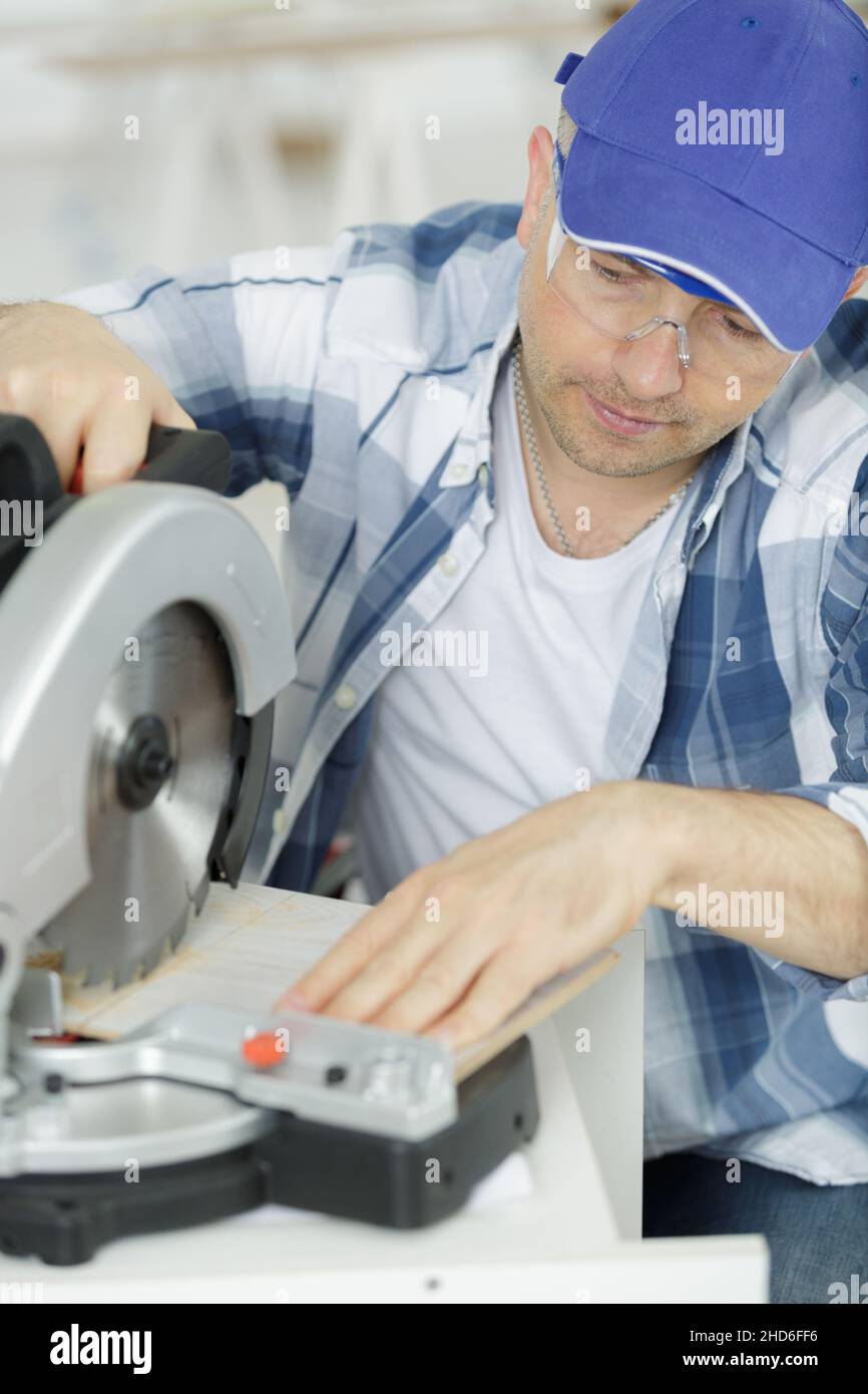Man using bow saw hi-res stock photography and images - Alamy