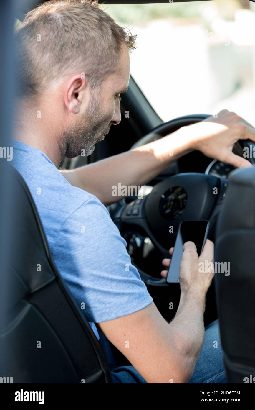 driver on the phone while driving a car Stock Photo - Alamy