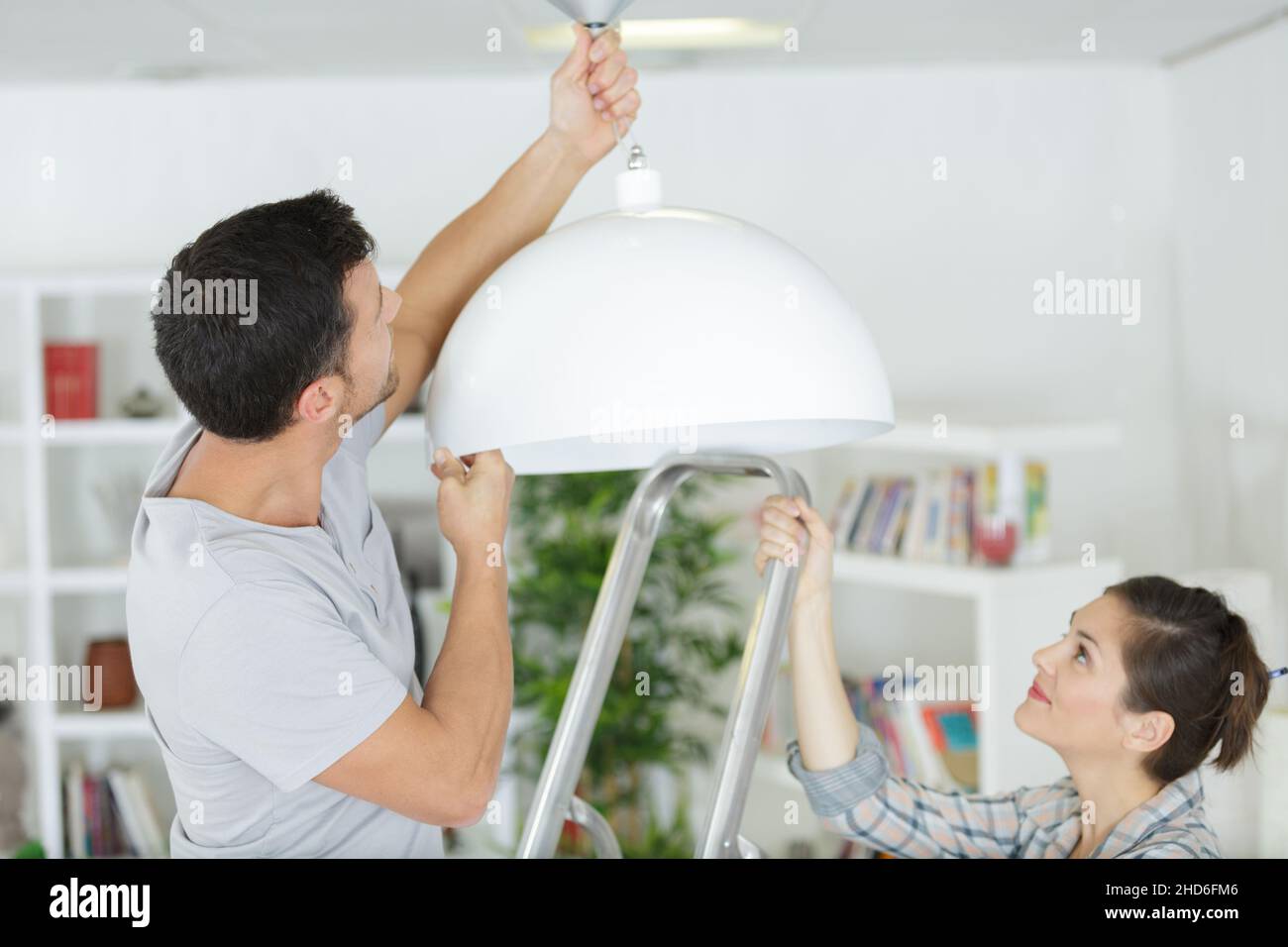 installing a lamp in the room Stock Photo - Alamy