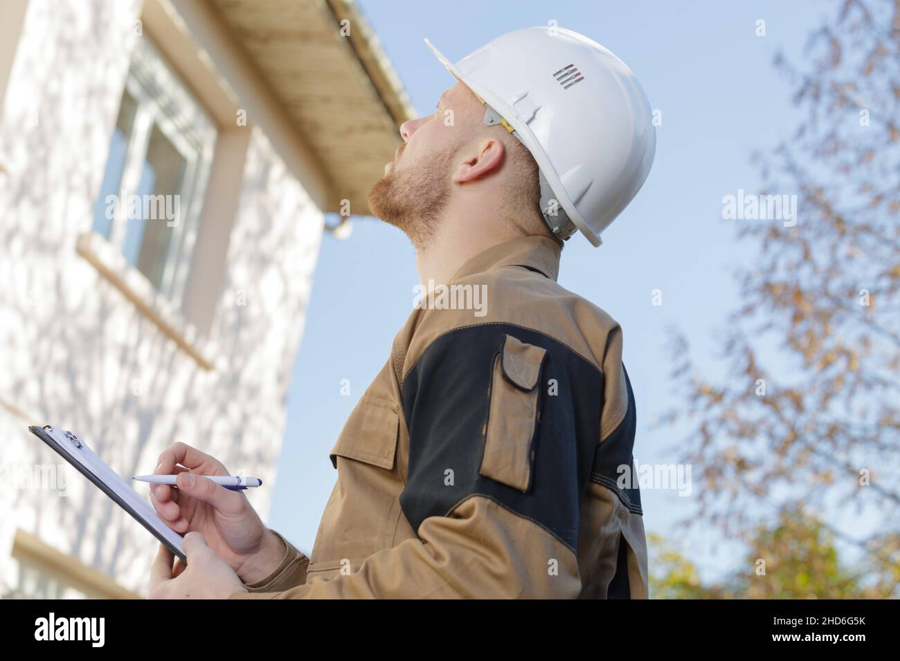building manager writing the list Stock Photo - Alamy