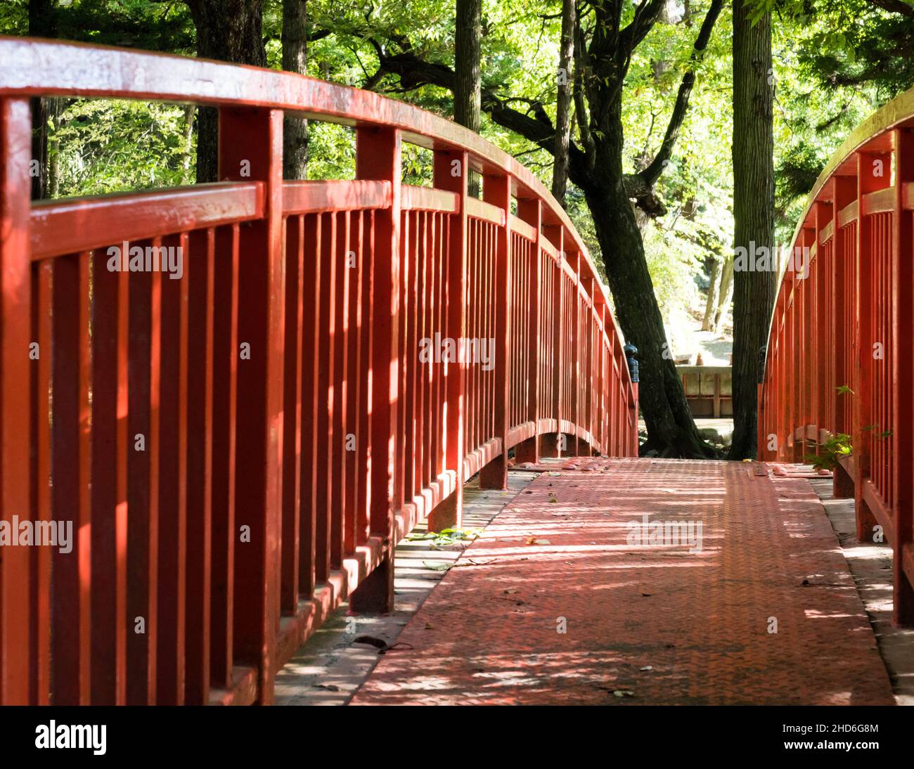 Red bridge across the Togawa river leading to Manji Stone Buddha in ...