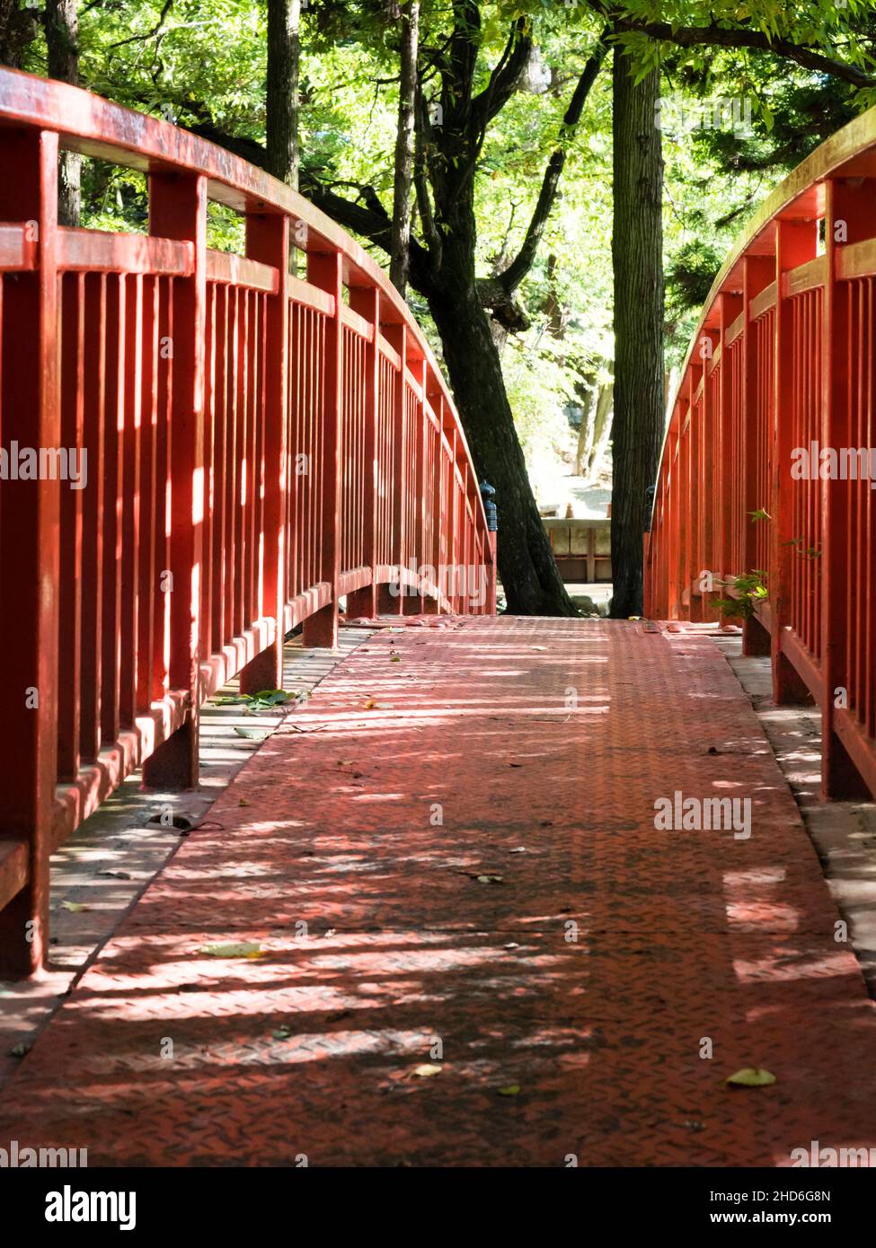 Red bridge across the Togawa river leading to Manji Stone Buddha in ...