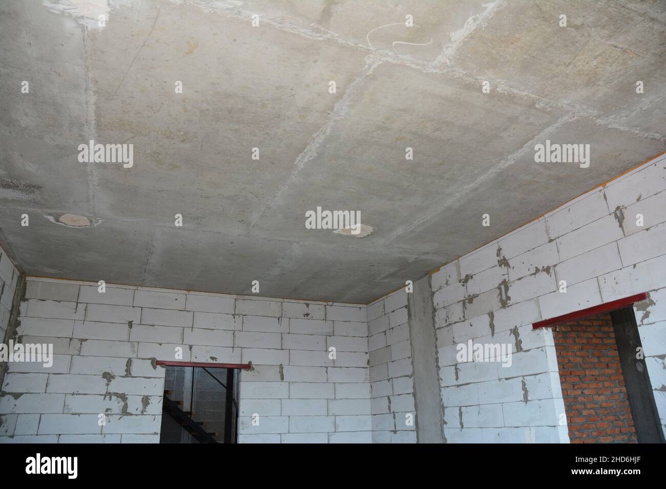 An inside view of an empty room of the house under construction with ...