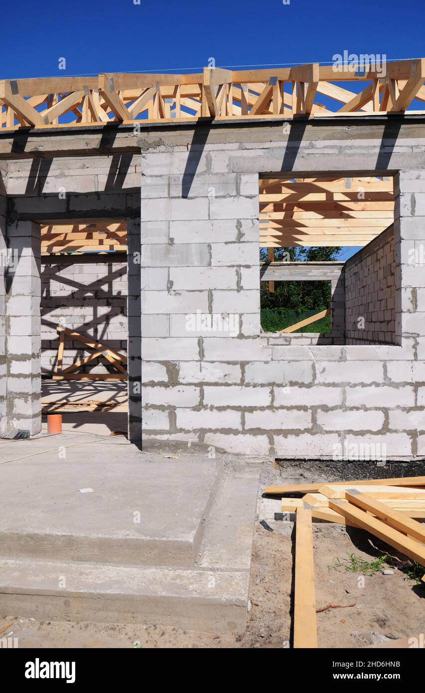 A house under construction with walls built from concrete blocks ...