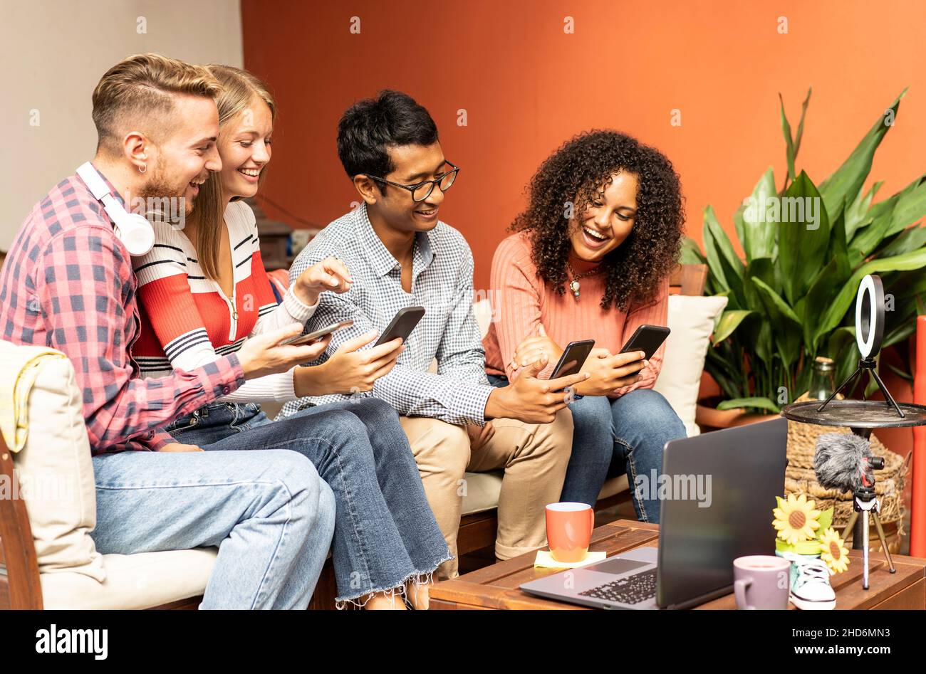 Young friends video calling together with their smartphones - Community ...