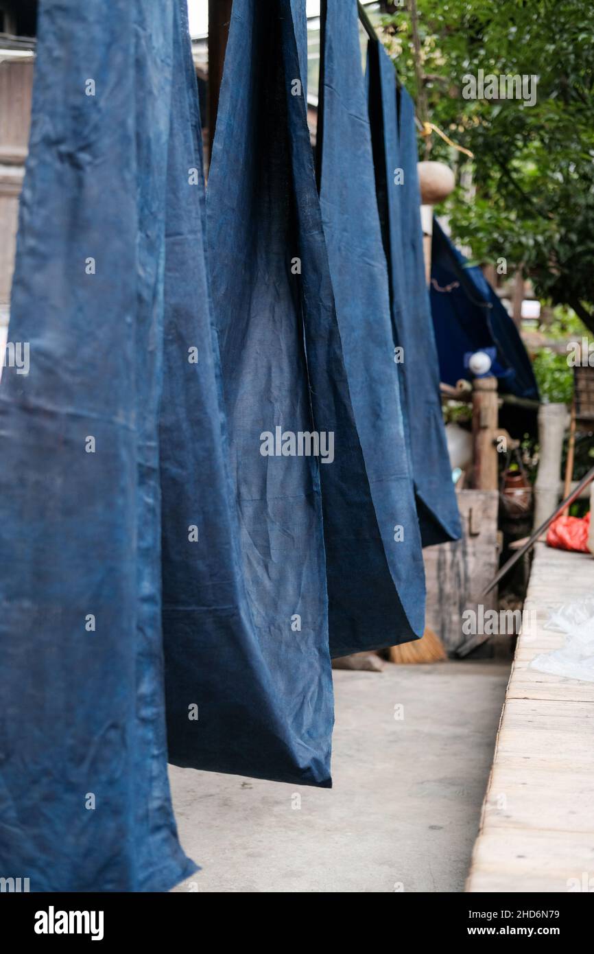 Hanging blue-dyed cloth Stock Photo - Alamy