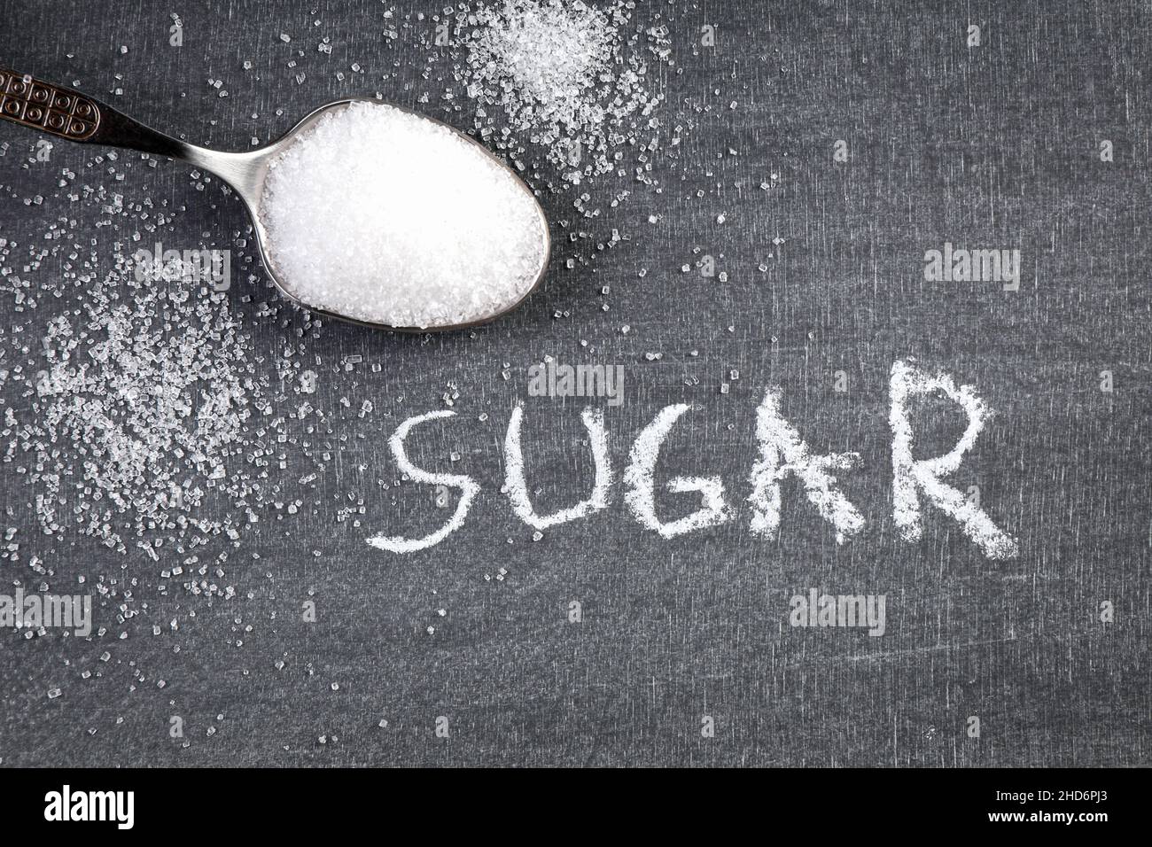 SUGAR. Chalk drawing. Teaspoon with white sugar on a blackboard Stock ...