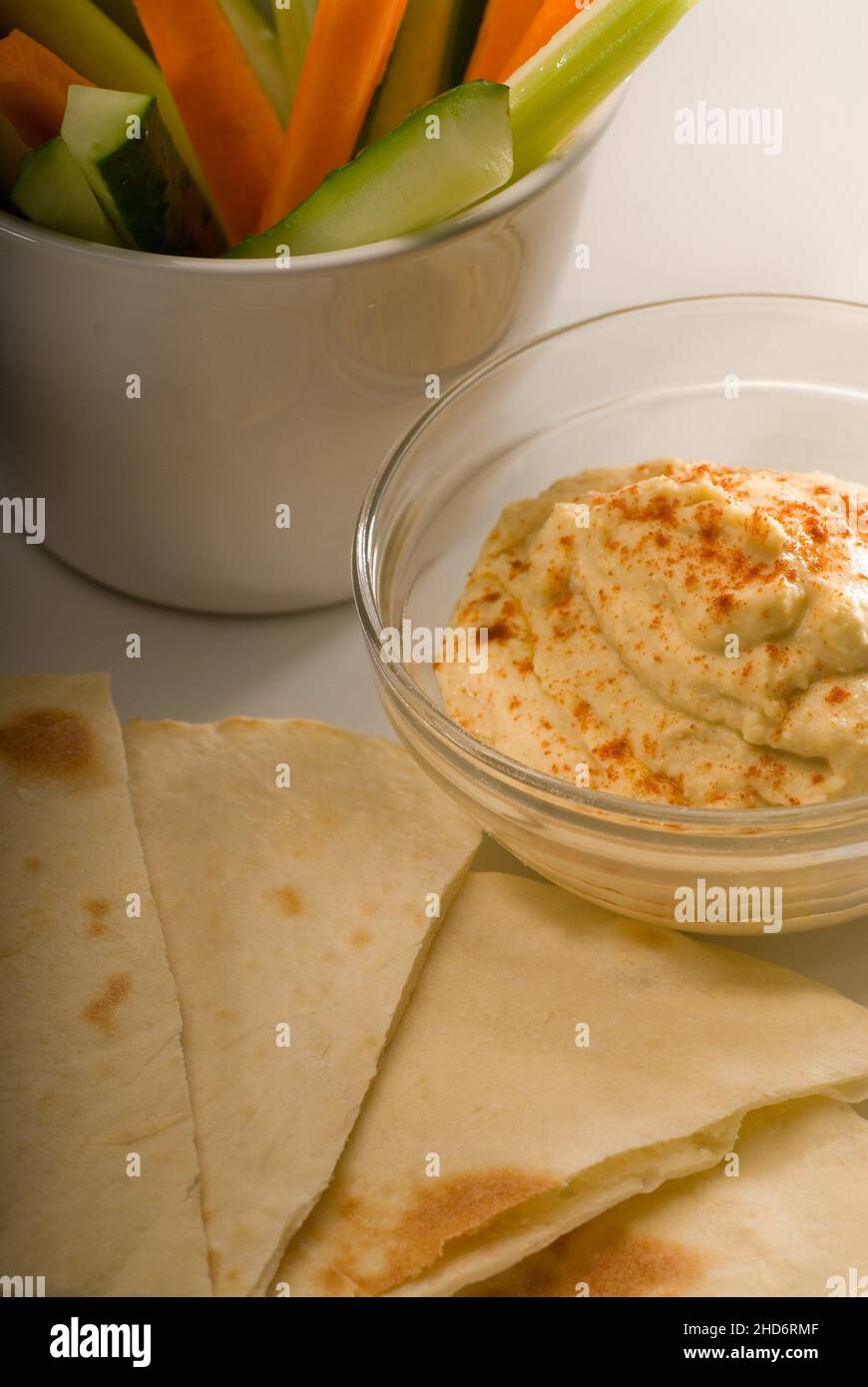 middle eastern hummus dip on a glass bowl with homemade pita bread and ...