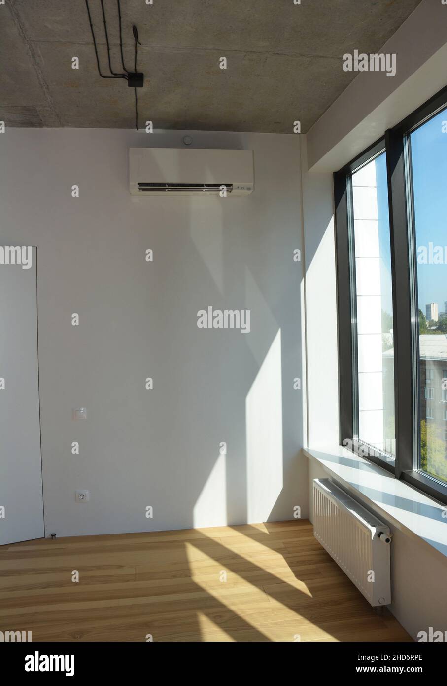 Empty room loft style design with a gray concrete loft ceiling, black ...