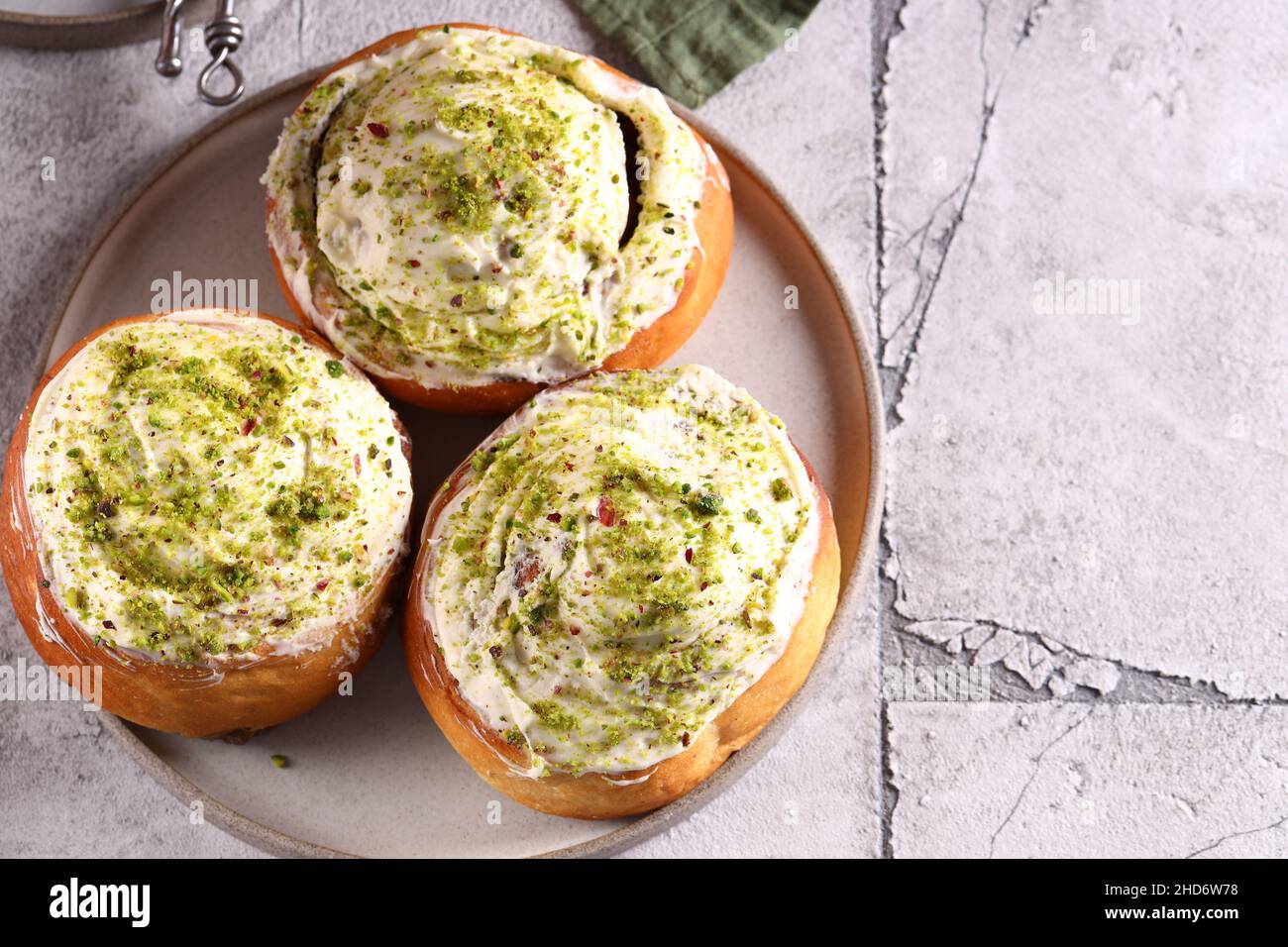 traditional cinnamon buns with icing Stock Photo - Alamy