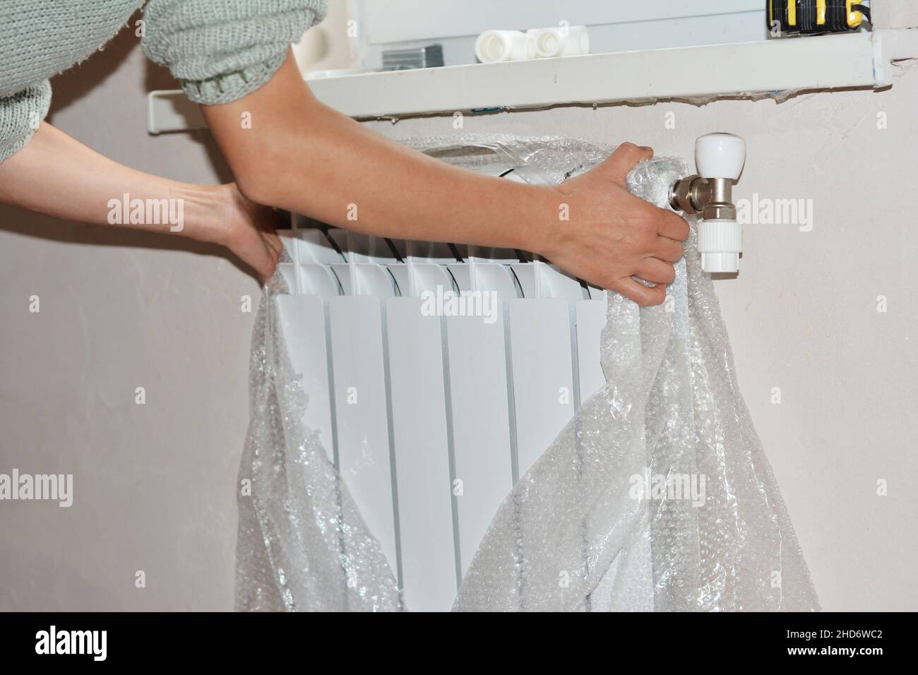 A radiator heater installation, replacement during the house renovation ...