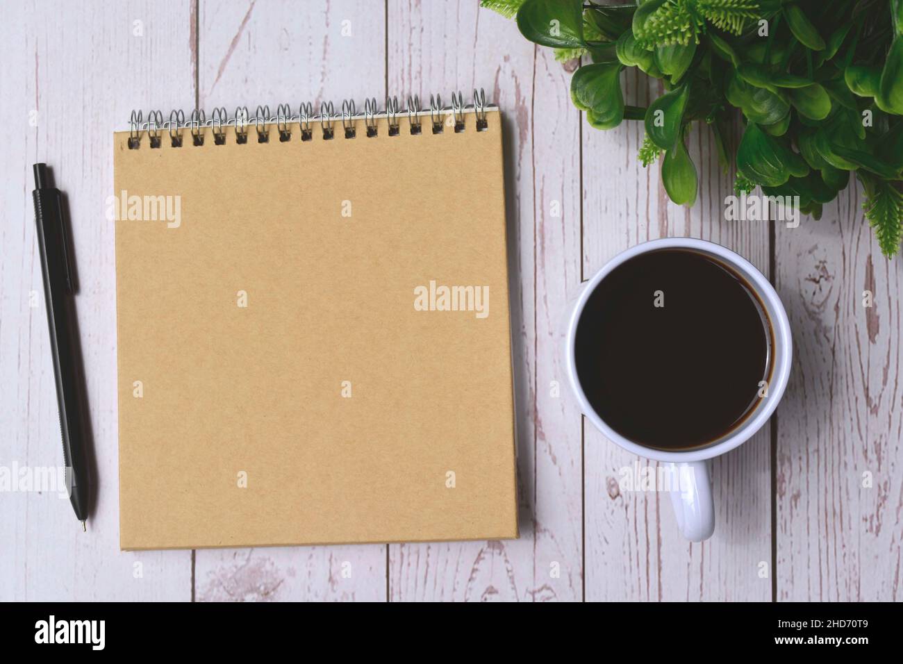 Top view of notepad and pen with cup of coffee on wooden desk Stock ...