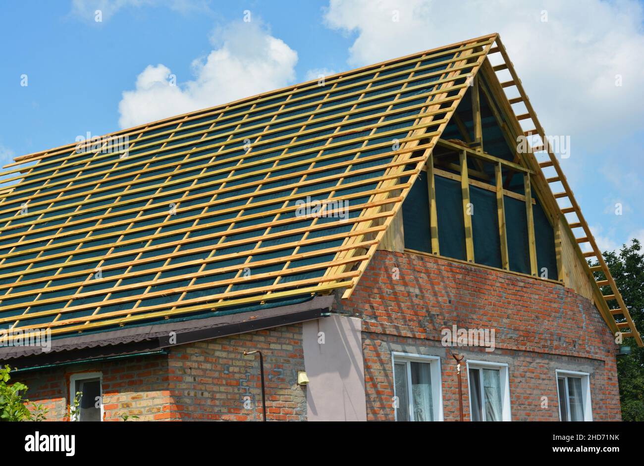 Roofing construction. Old brick house renovation with a new roofing ...