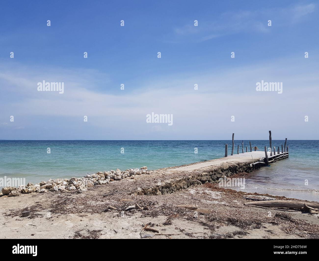 Wooden beach deck on the coast of the sea with a clear sky and ...