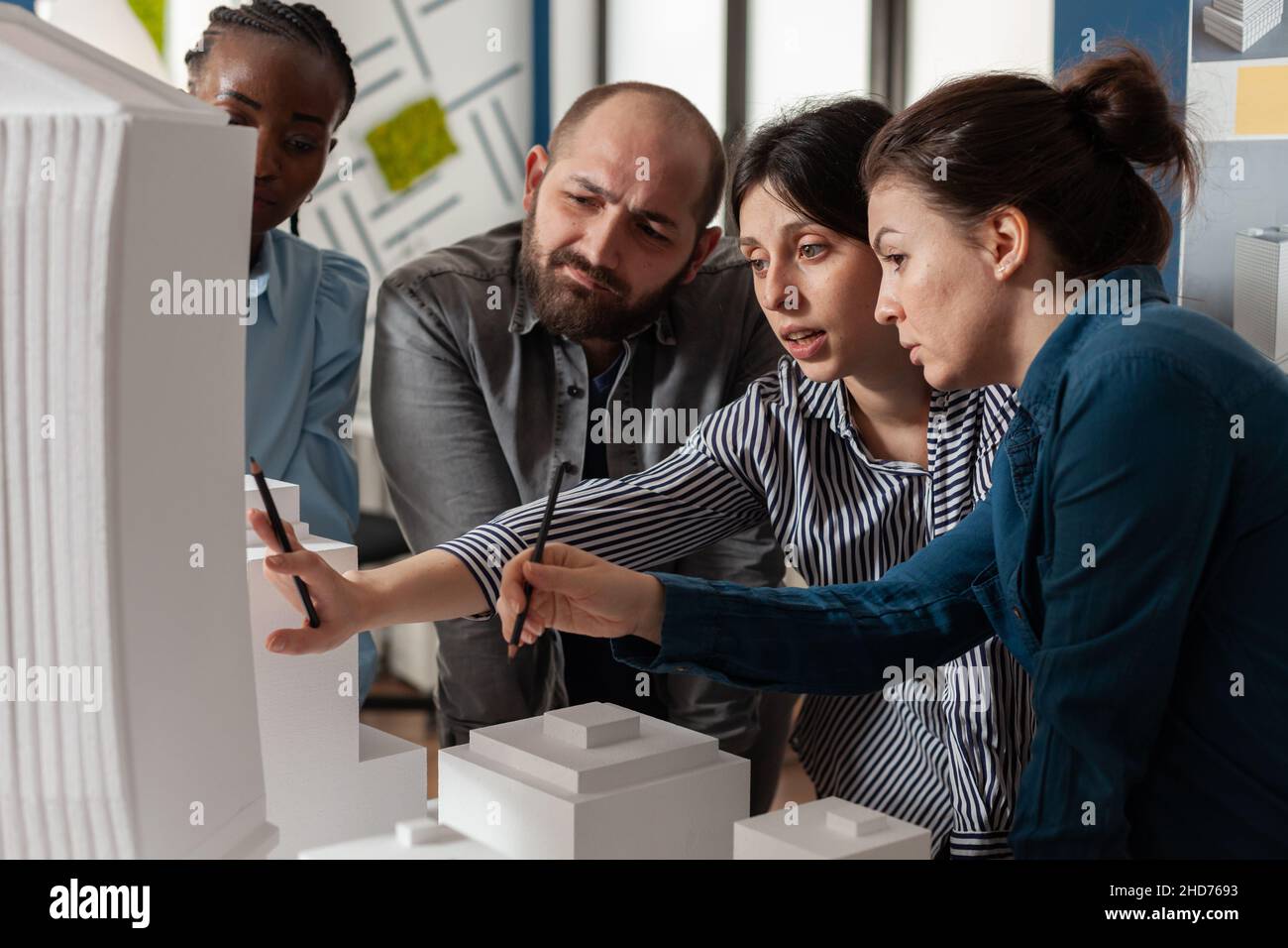 Architect explaining design scale model hi-res stock photography and ...