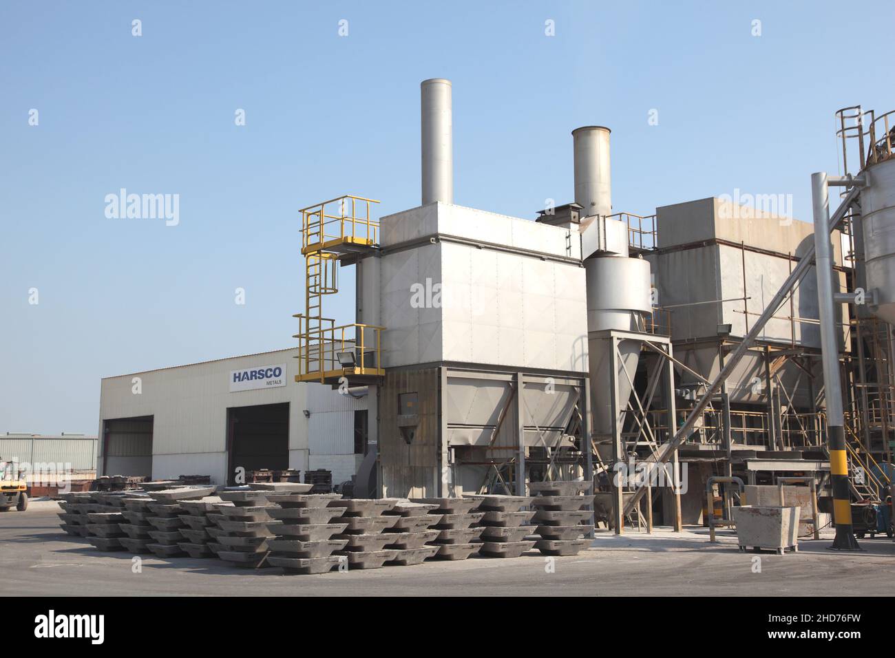 Recovered aluminium ingots outside a metal recovery plant in Bahrain ...