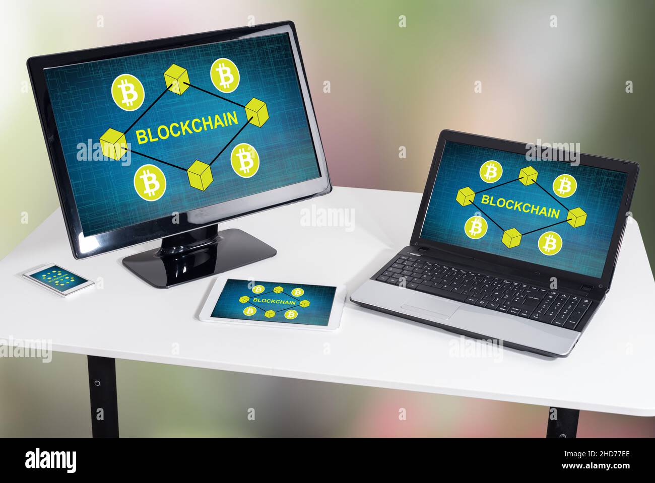 Blockchain concept shown on different information technology devices ...