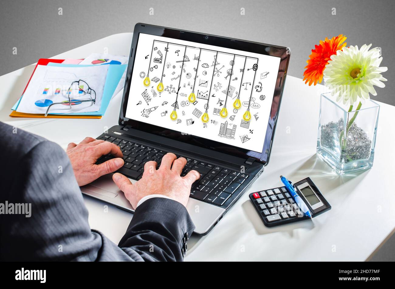 Man typing on a laptop showing a creativity concept Stock Photo - Alamy