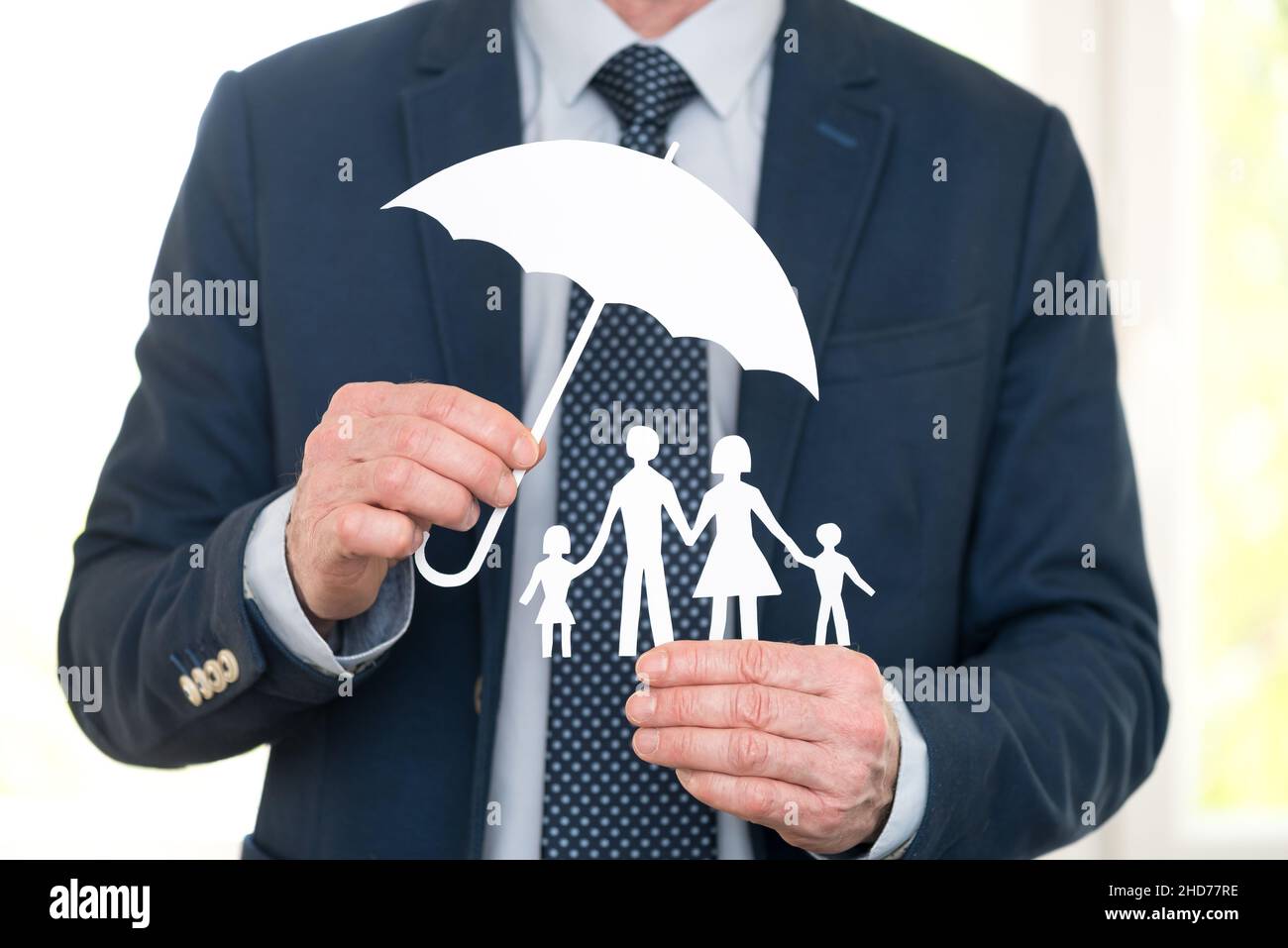 Symbol of family protection by a general agent Stock Photo - Alamy