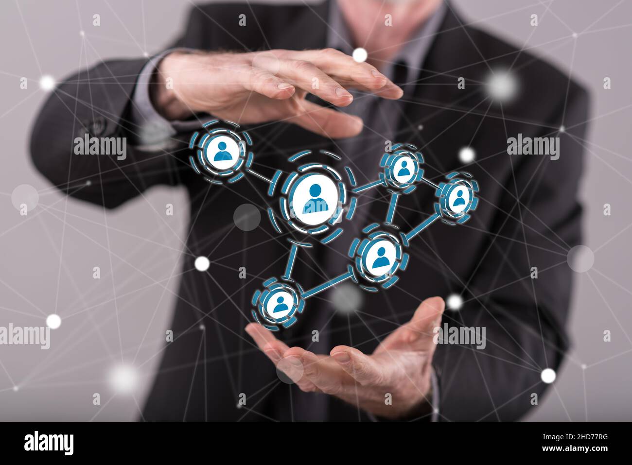 Social media and teamwork concept between hands of a man in background ...