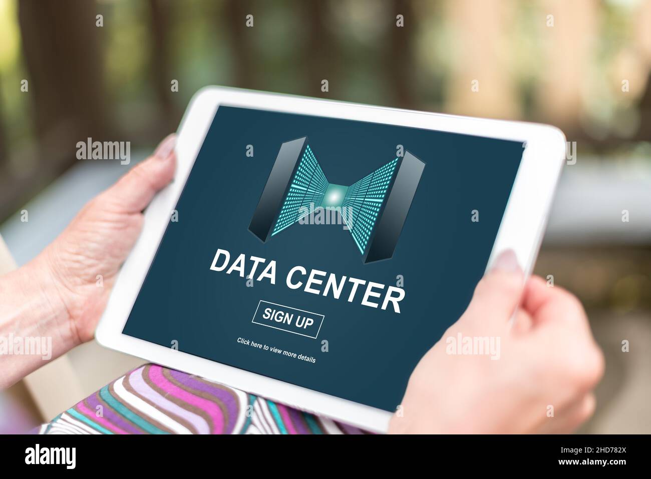 Female hands holding a tablet with data center concept Stock Photo - Alamy