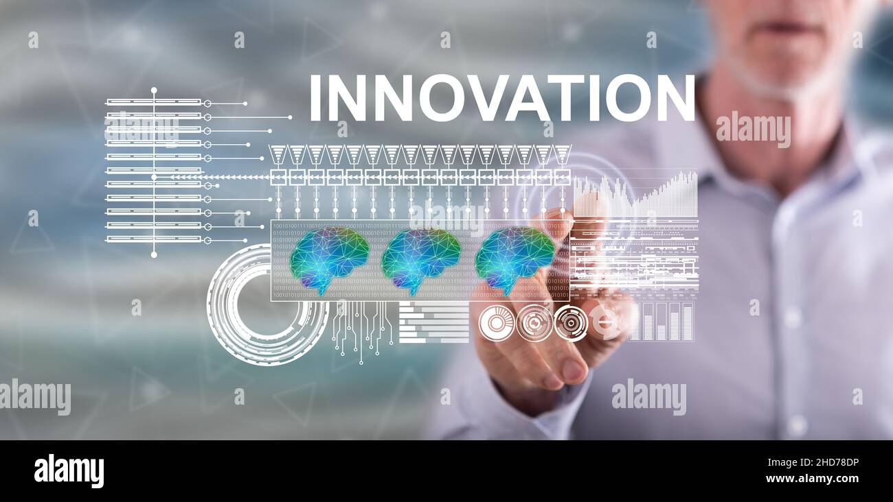 Man touching an innovation concept on a touch screen with his finger ...