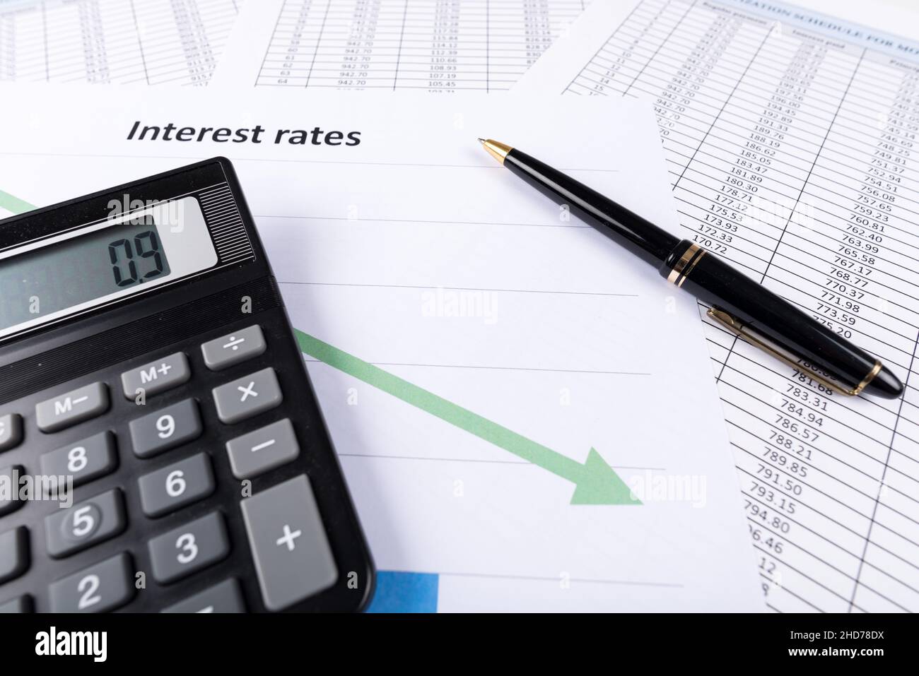 Interest rates documents with calculator Stock Photo - Alamy