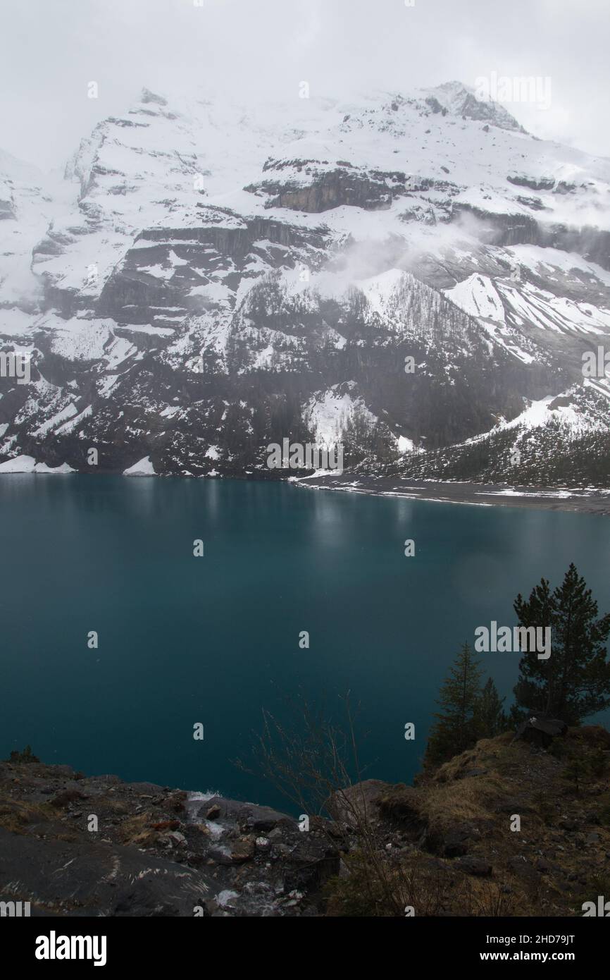 Oeschinensee, Kandersteg Switzerland, in spring with fog and snow Stock ...