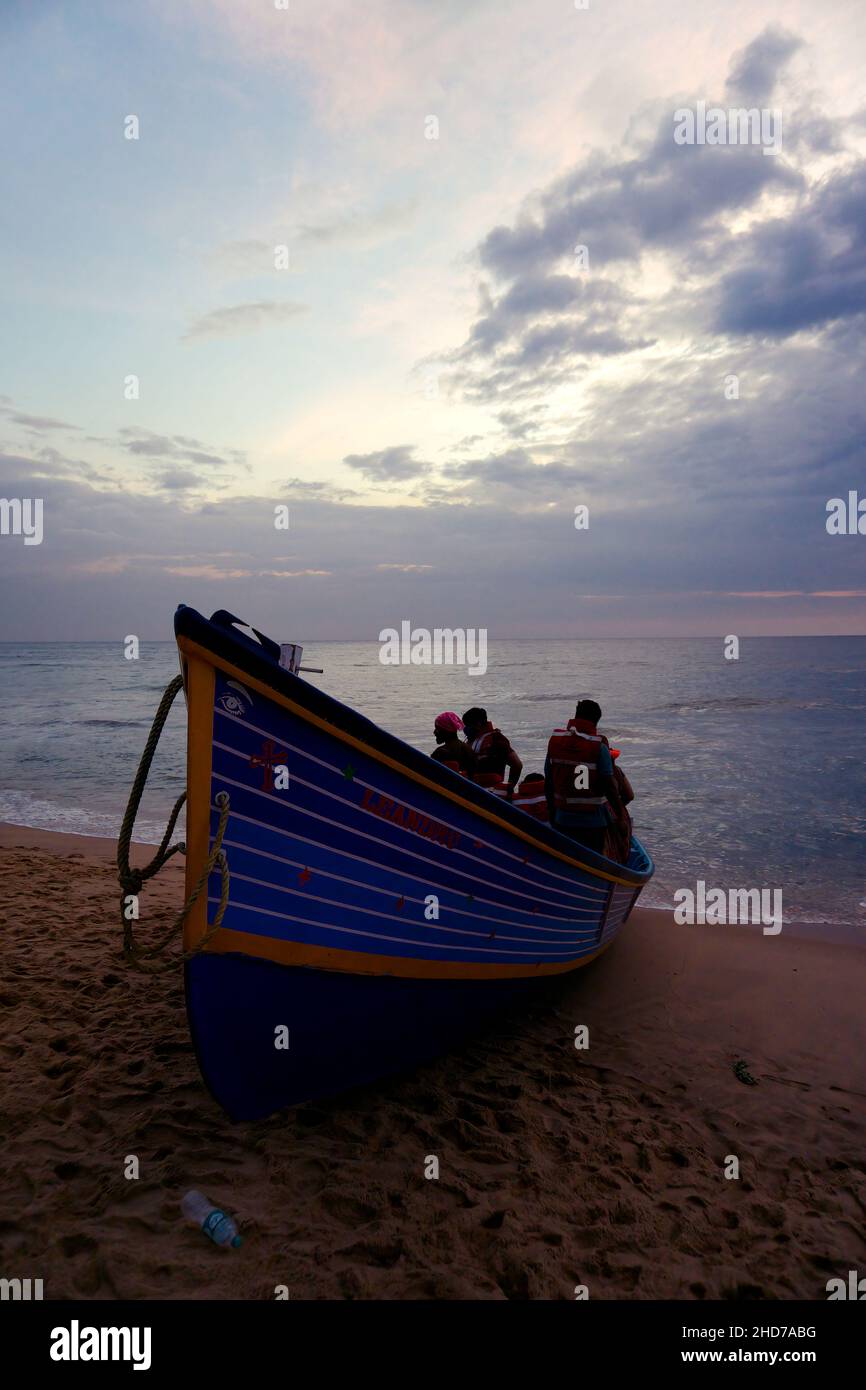 VARKALA, KERALA, INDIA - DECEMBER 31, 2021: Men getting ready to take ...