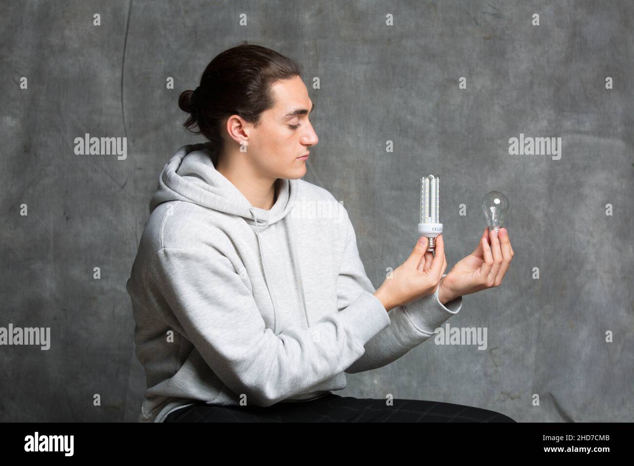 Model with high and low power consumption bulbs Stock Photo - Alamy