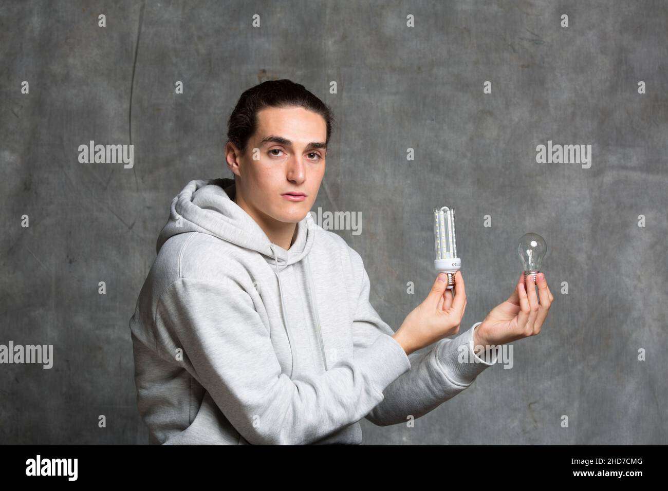 Model with high and low power consumption bulbs Stock Photo - Alamy